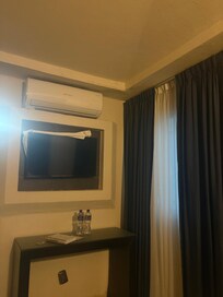 Original room towel over TV to prevent damage from AC