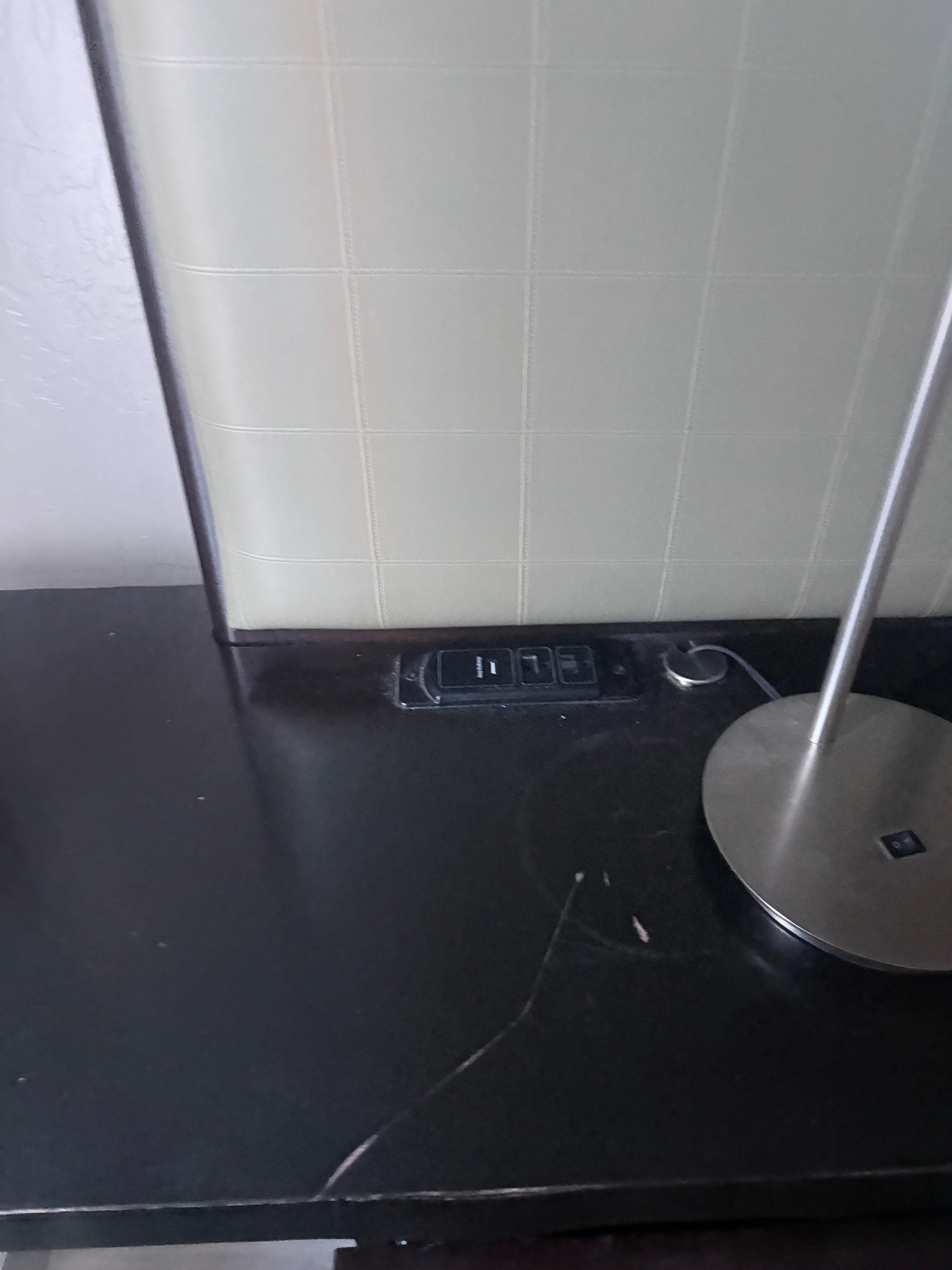 Hard to see but the outlets are blocked by the headboard and are unusable 