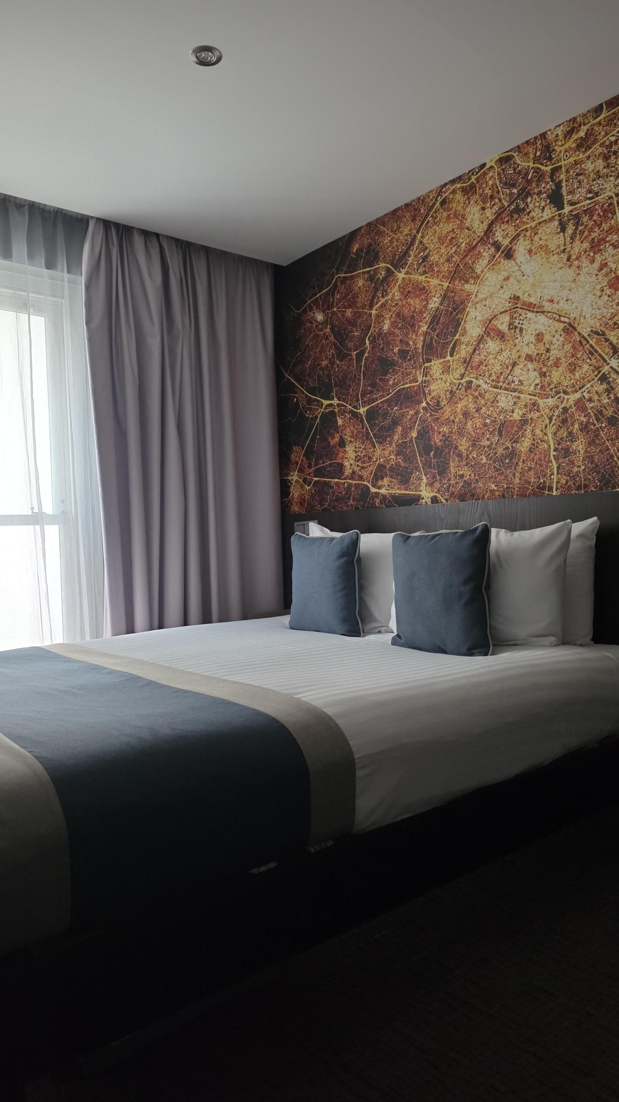 Bed next to the window. 