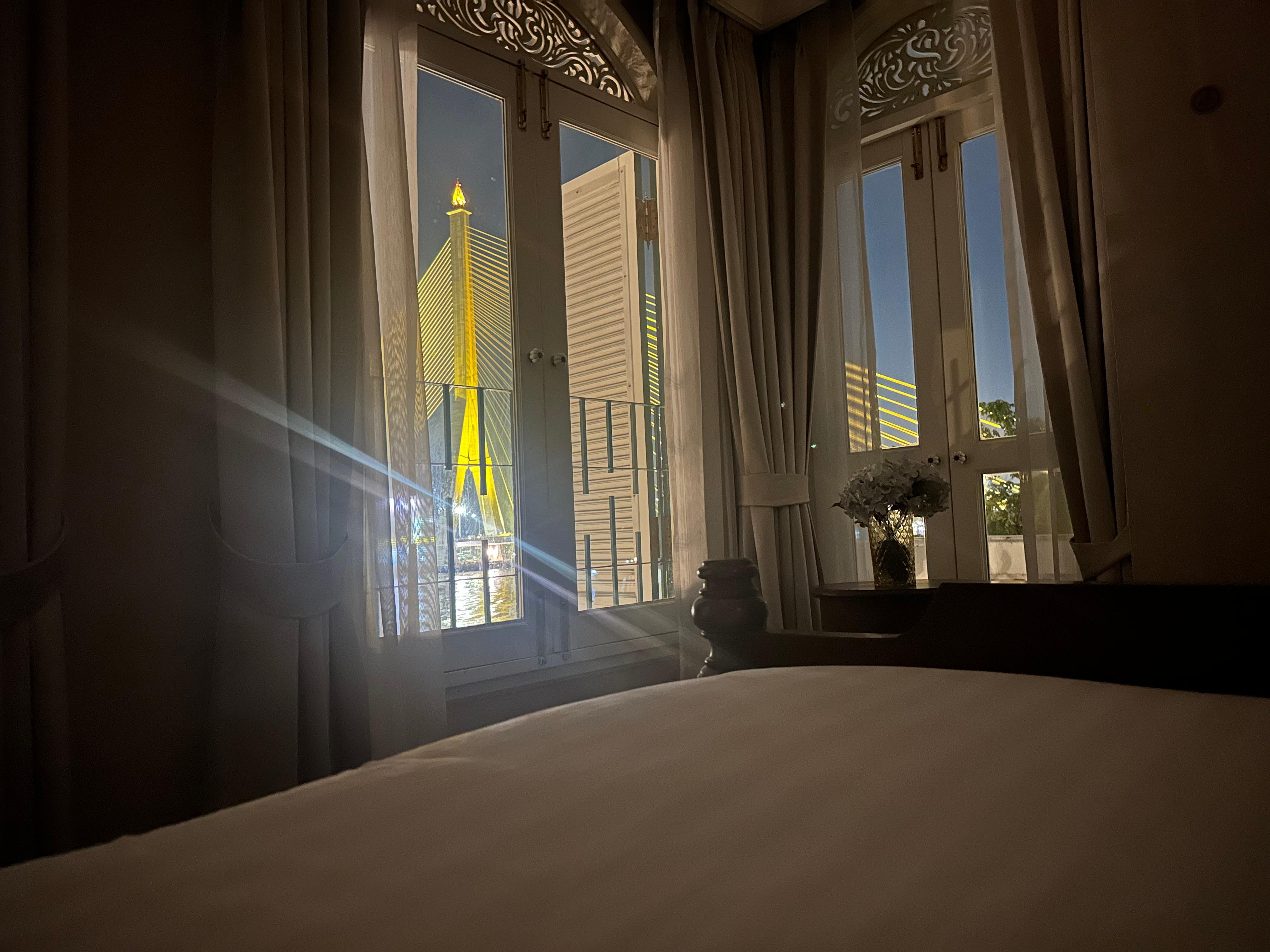 Photo taken from the bed. Nice view to the beautiful Rama VIII bridge, where also most of the river cruises turn. 