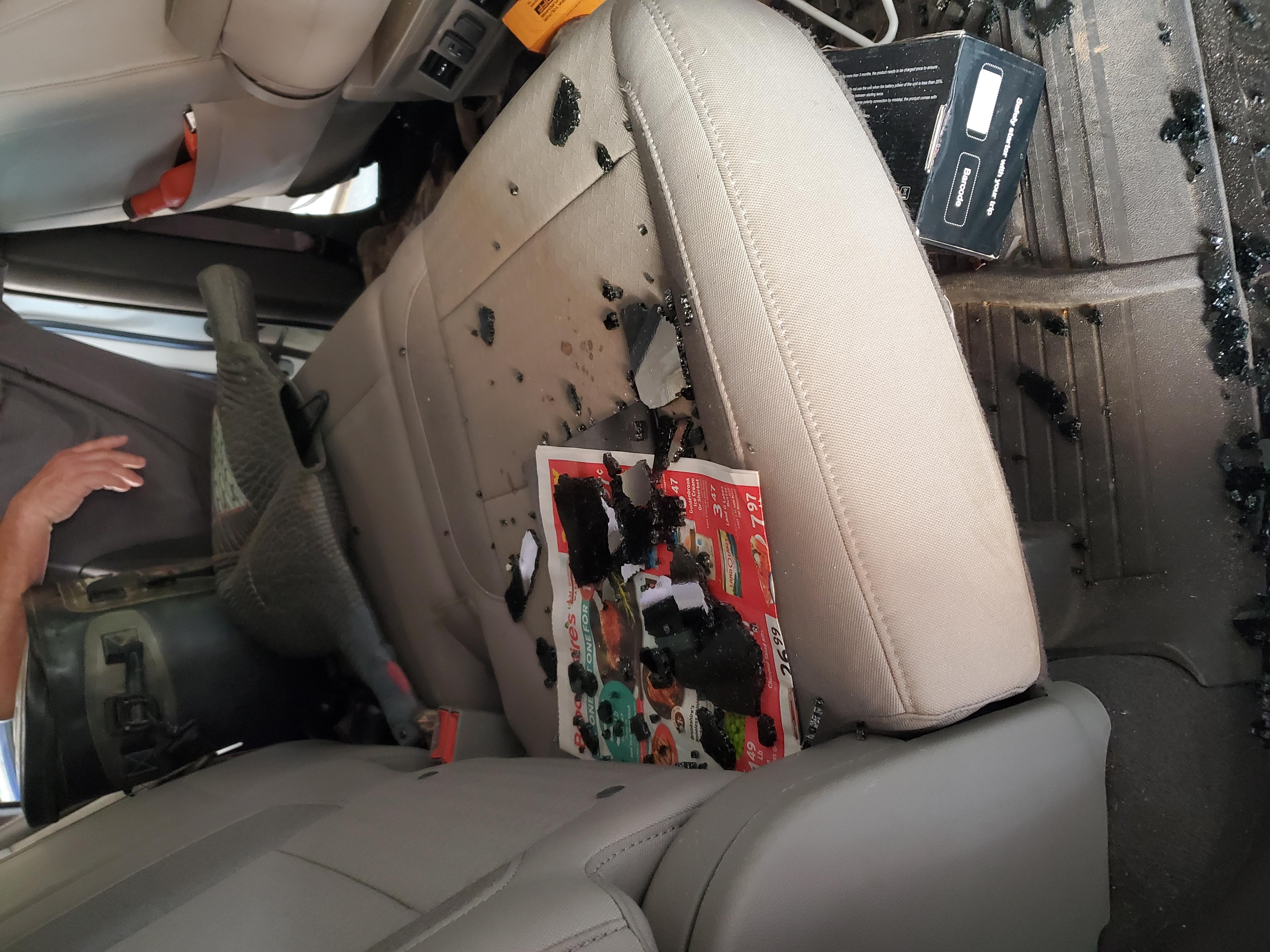 Vandalized vehicle, internal mess/glass inside