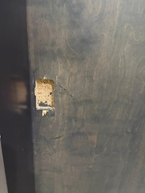 Hole in the bathroom door, which was heavy and hard to open
