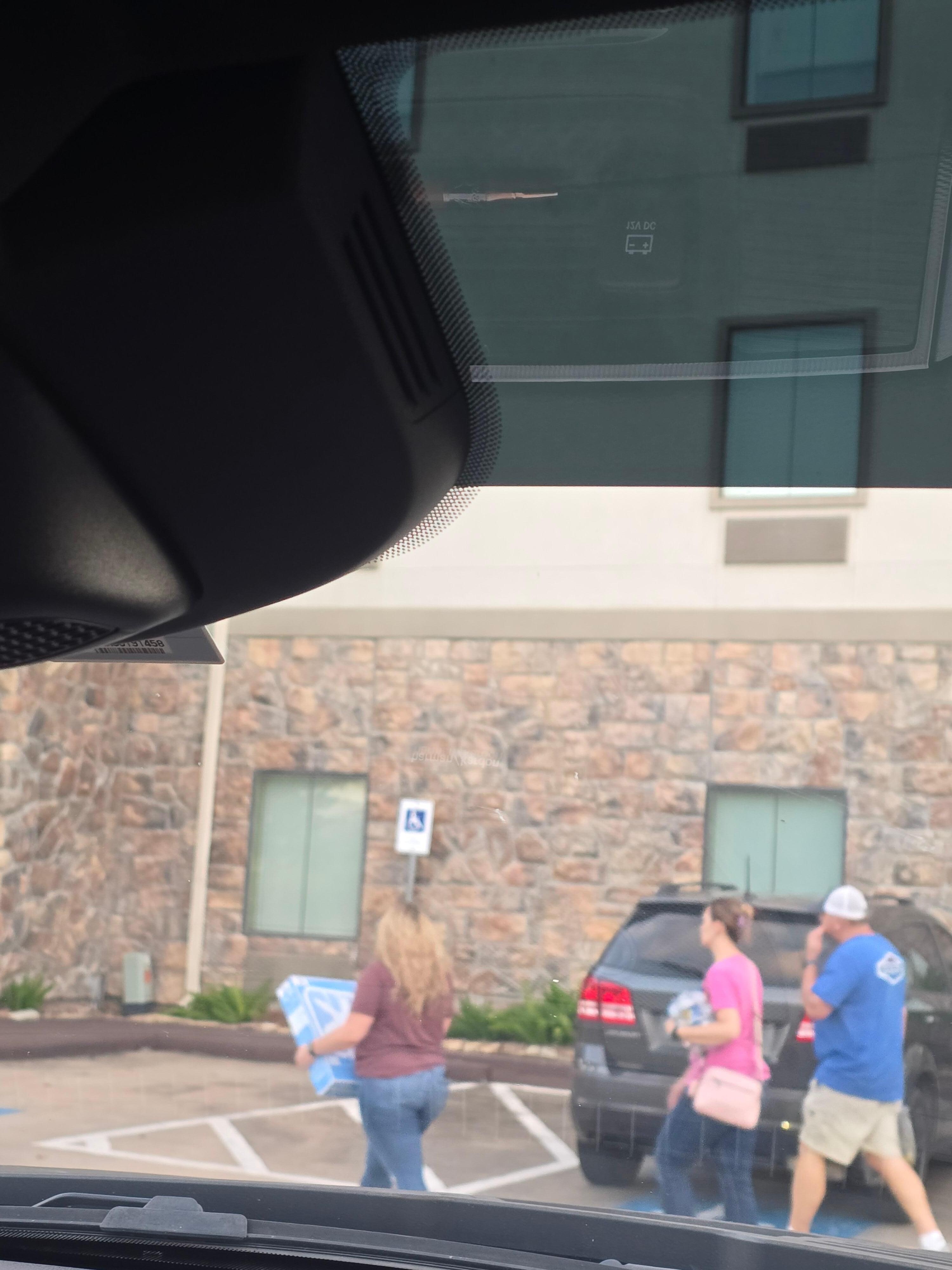Guests carrying bix fan in they had to buy to try to cool off.