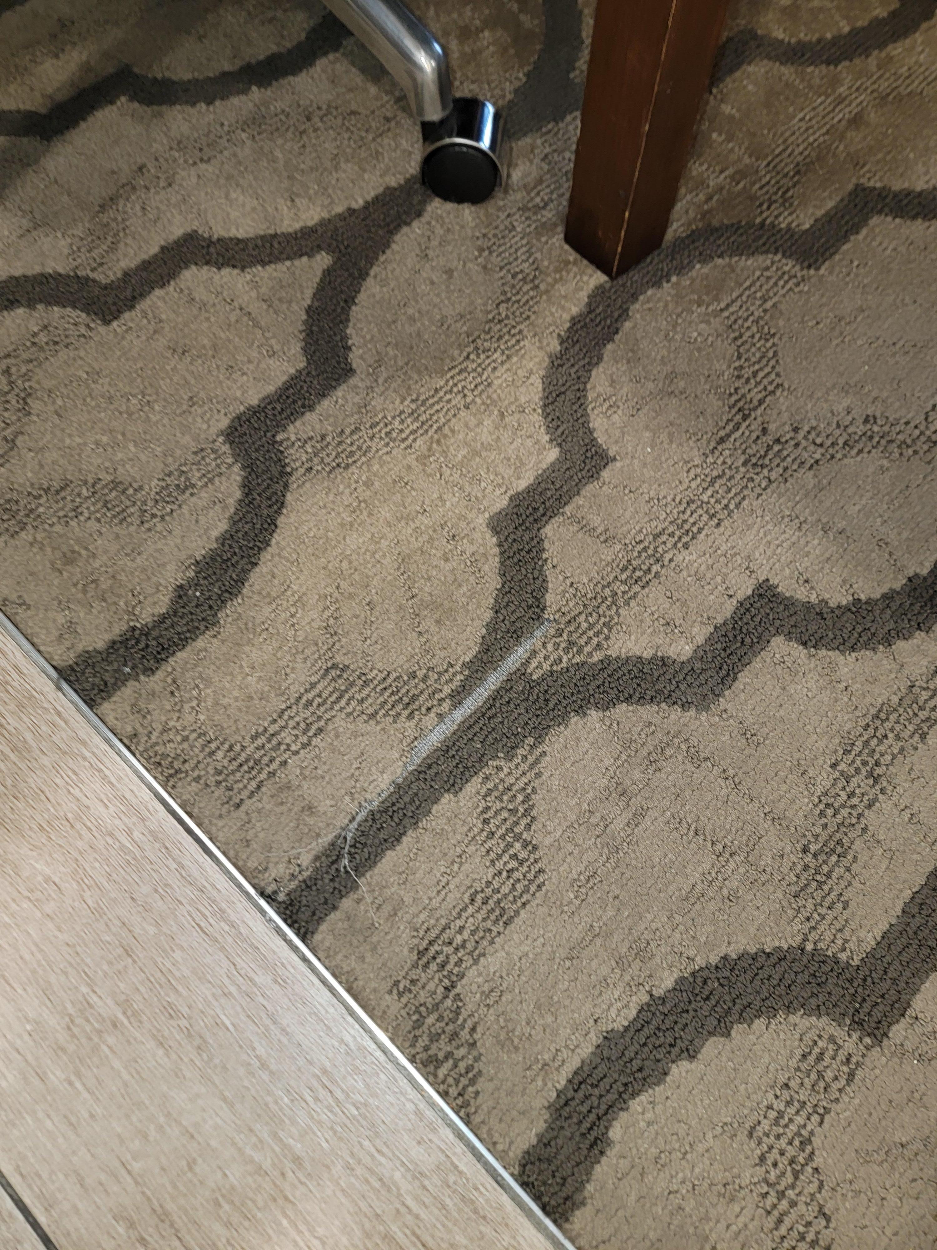 Another area of torn carpet