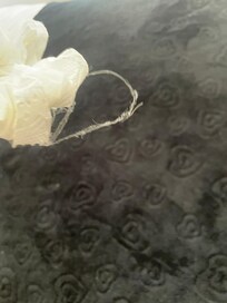 Next to the headboard, cobwebs wiped off using tissue.