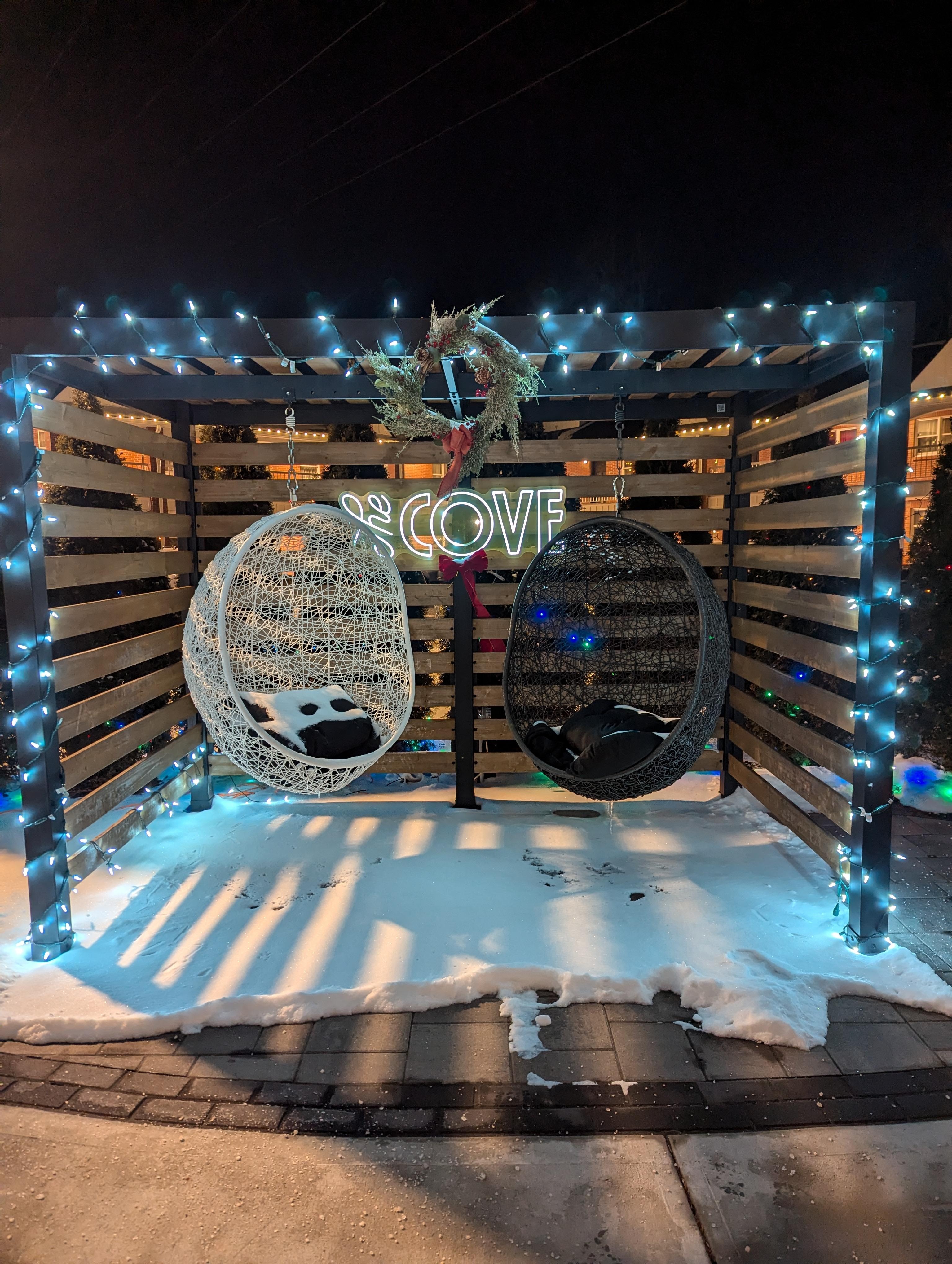 Outdoor seating area with fire pit and grill area.