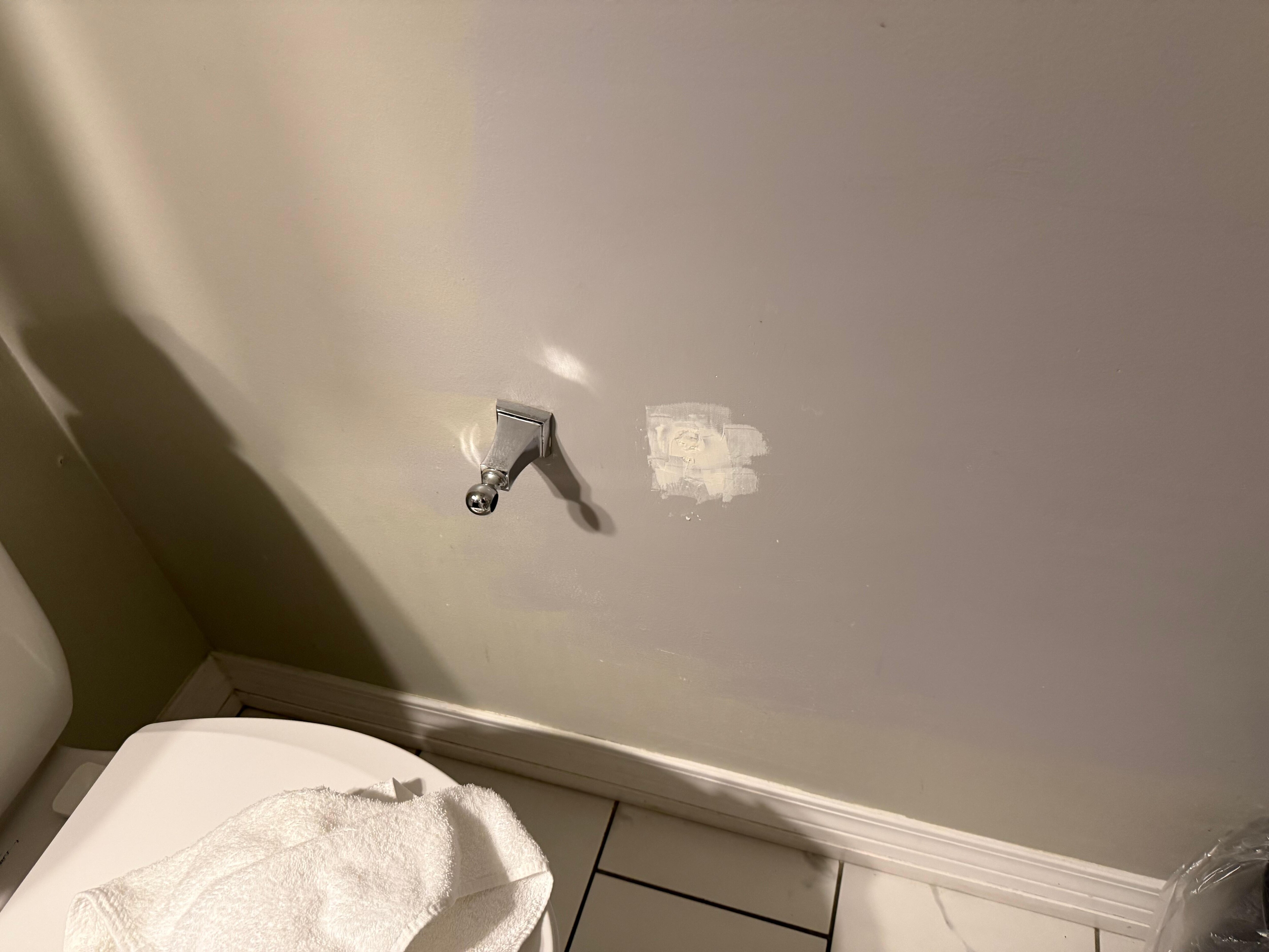 Partially repaired toilet holder