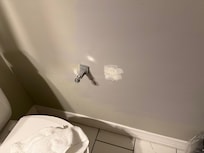 Partially repaired toilet holder