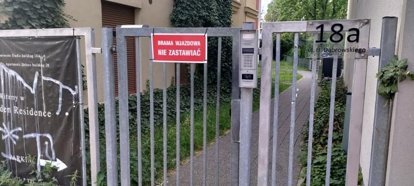 Defaced welcome sign: Graffiti-covered and surrounded by overgrown weeds, clearly showing neglect.
Broken gate lock: Clearly visible damage showing major security risk.