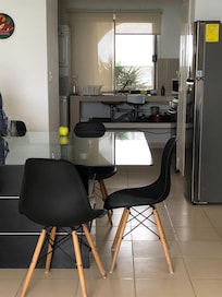 Kitchen view overlook’s entrance hallway & top of hospital in Kukulkan Plaza.