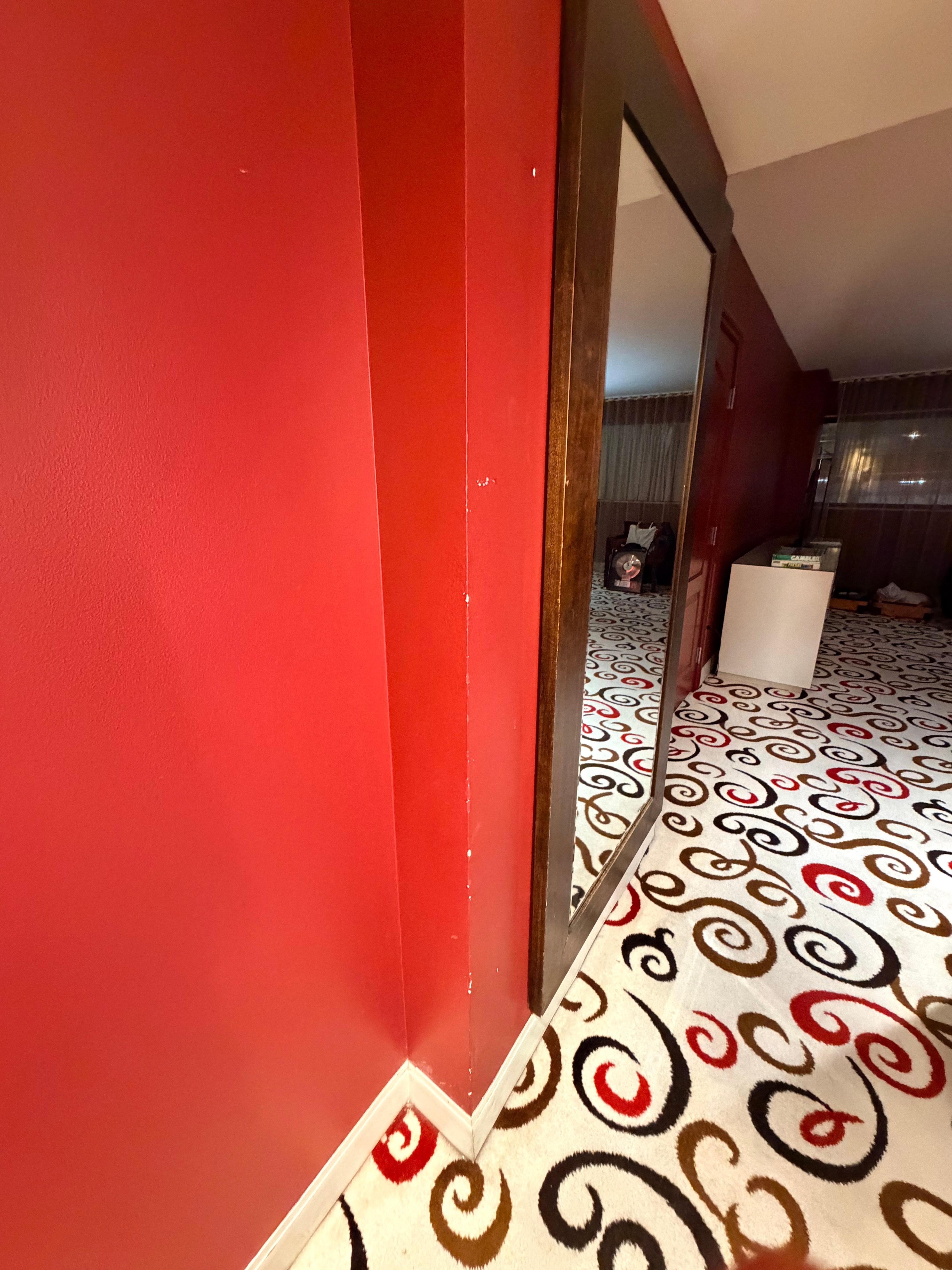 Chipping paint. Why are the walls blood red?