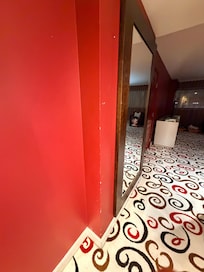 Chipping paint. Why are the walls blood red?