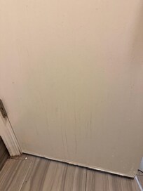 Room door covered in filth.