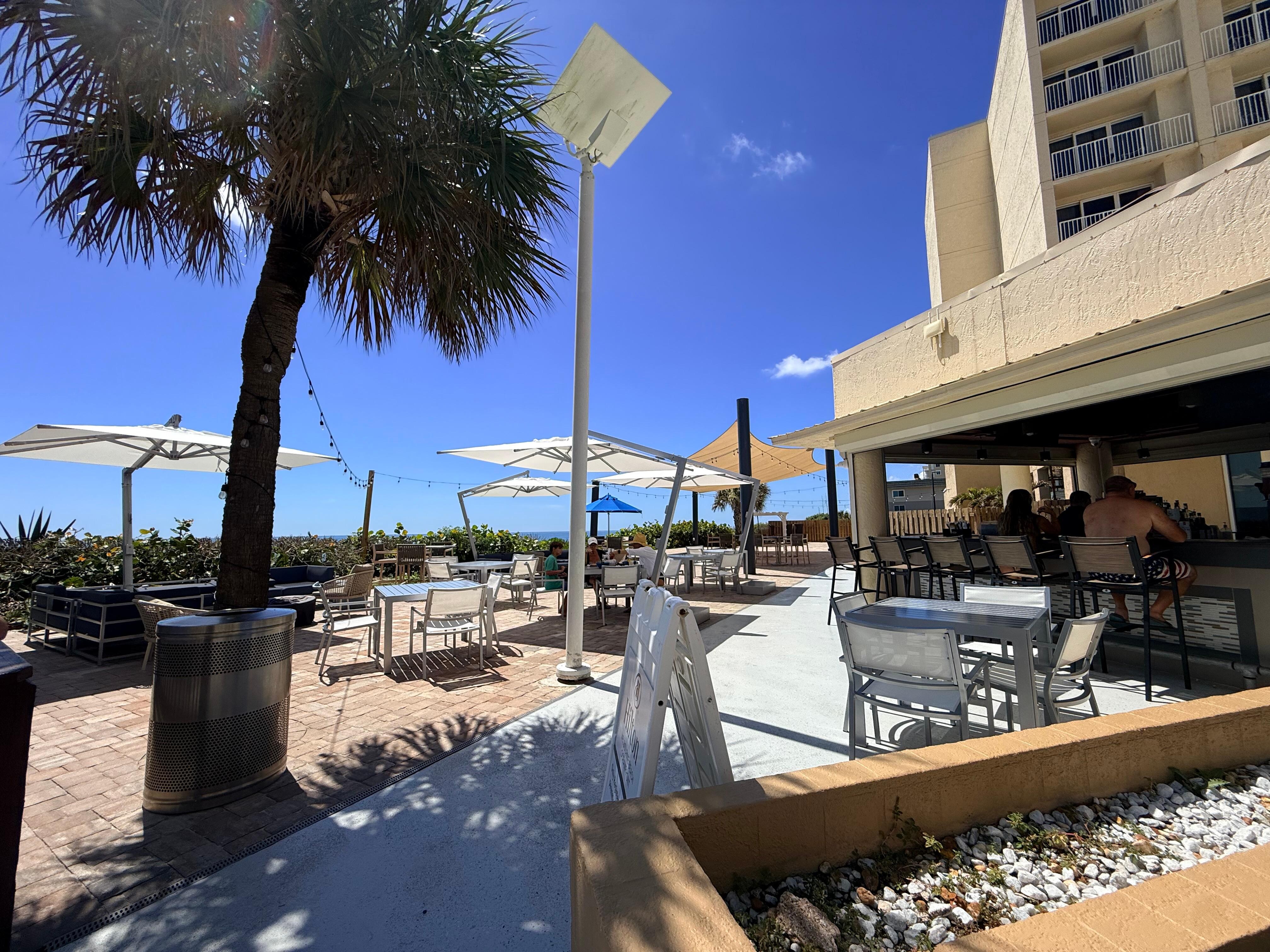 Tiki bar and area between pool and beach 