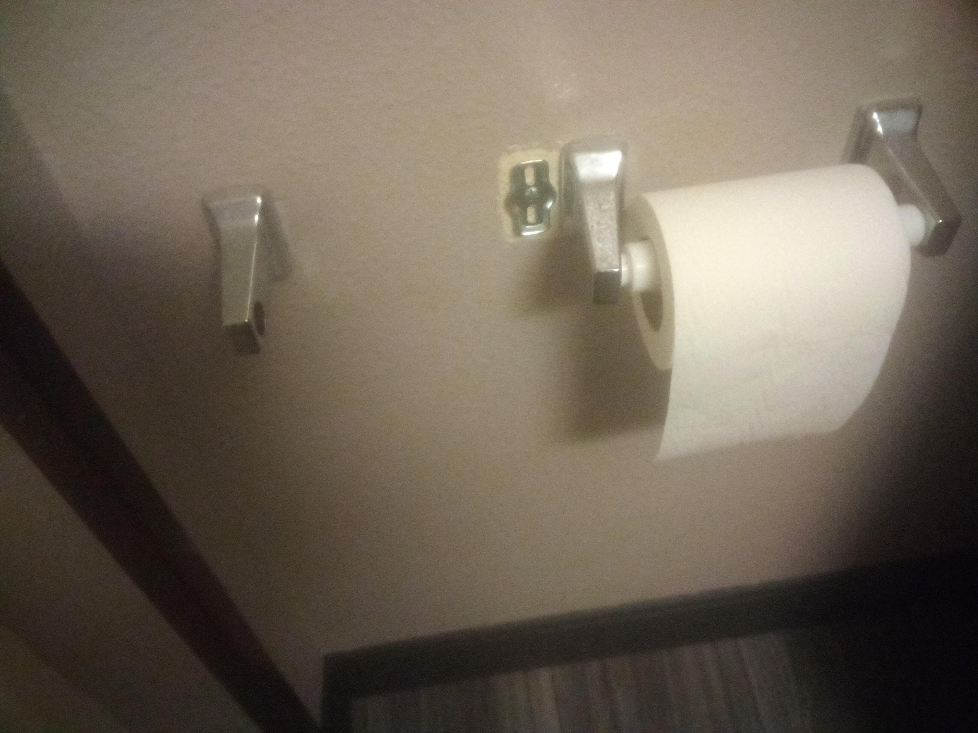 Broken/poorly affixed toilet paper dispensers
