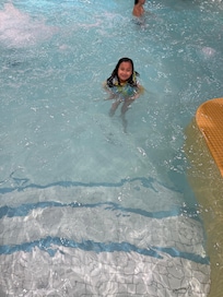 My daughter and her cousin enjoy their swimming.