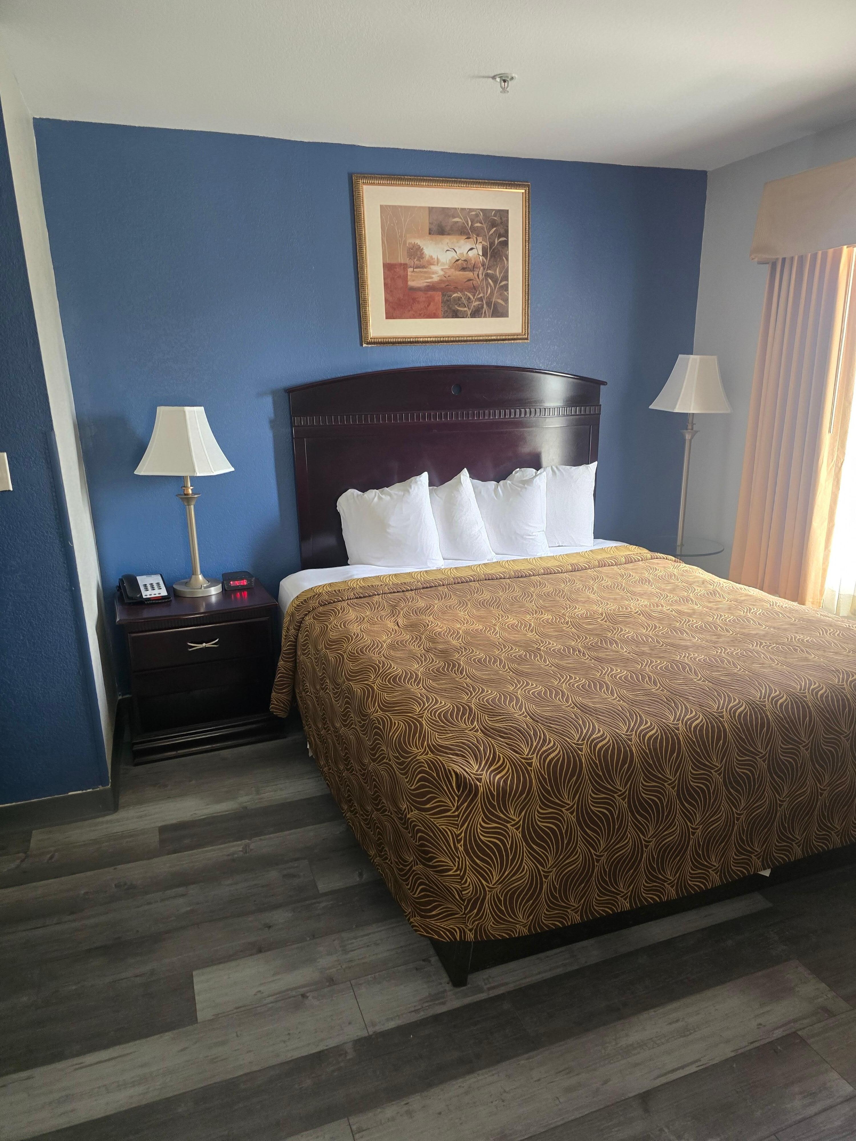 Bed is directly located next to door.