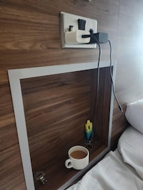 Cubby between the beds, beds have PERFECT charging stations, cubby works as a side table!