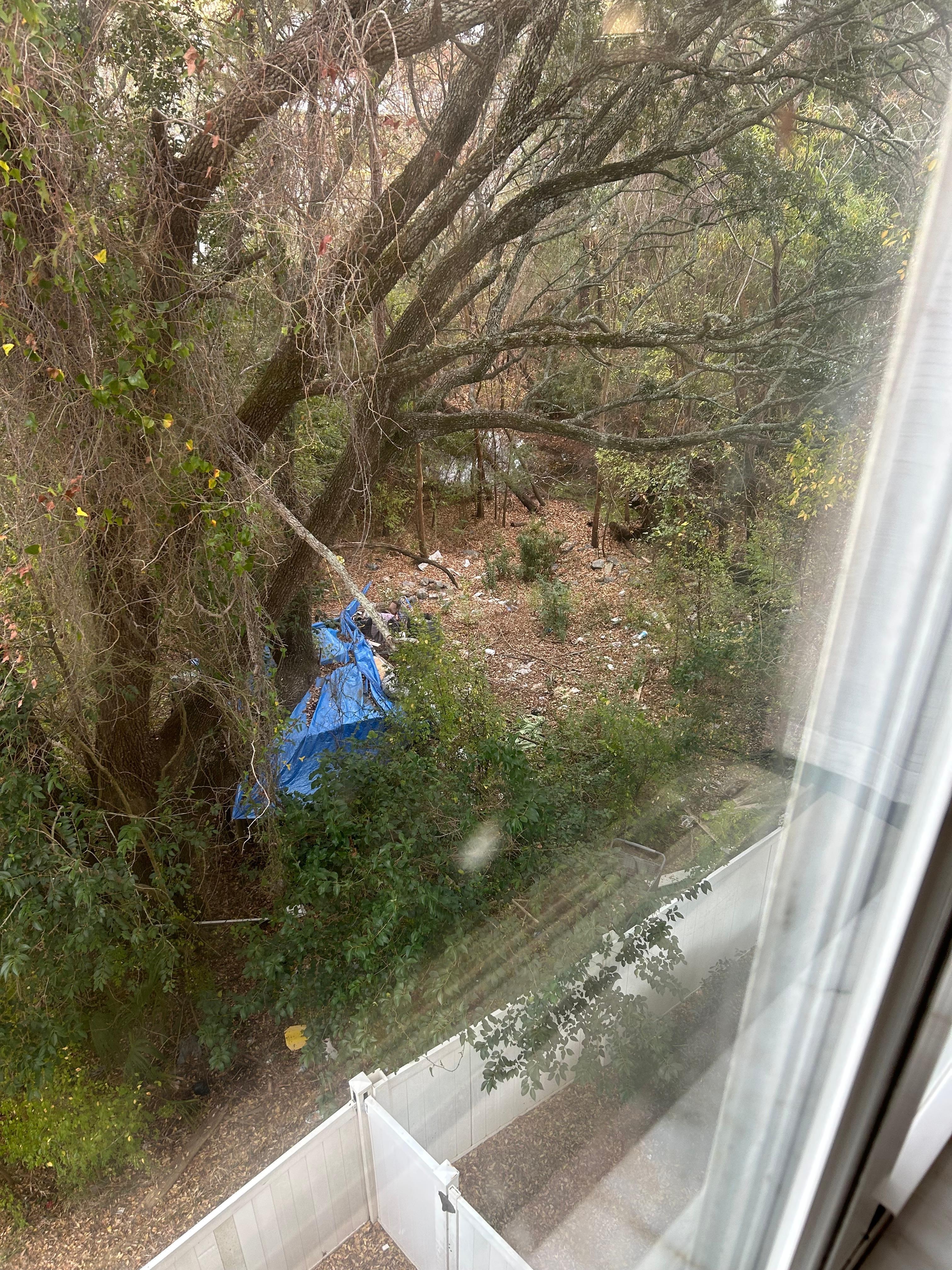 Homeless encampment next to hotel.