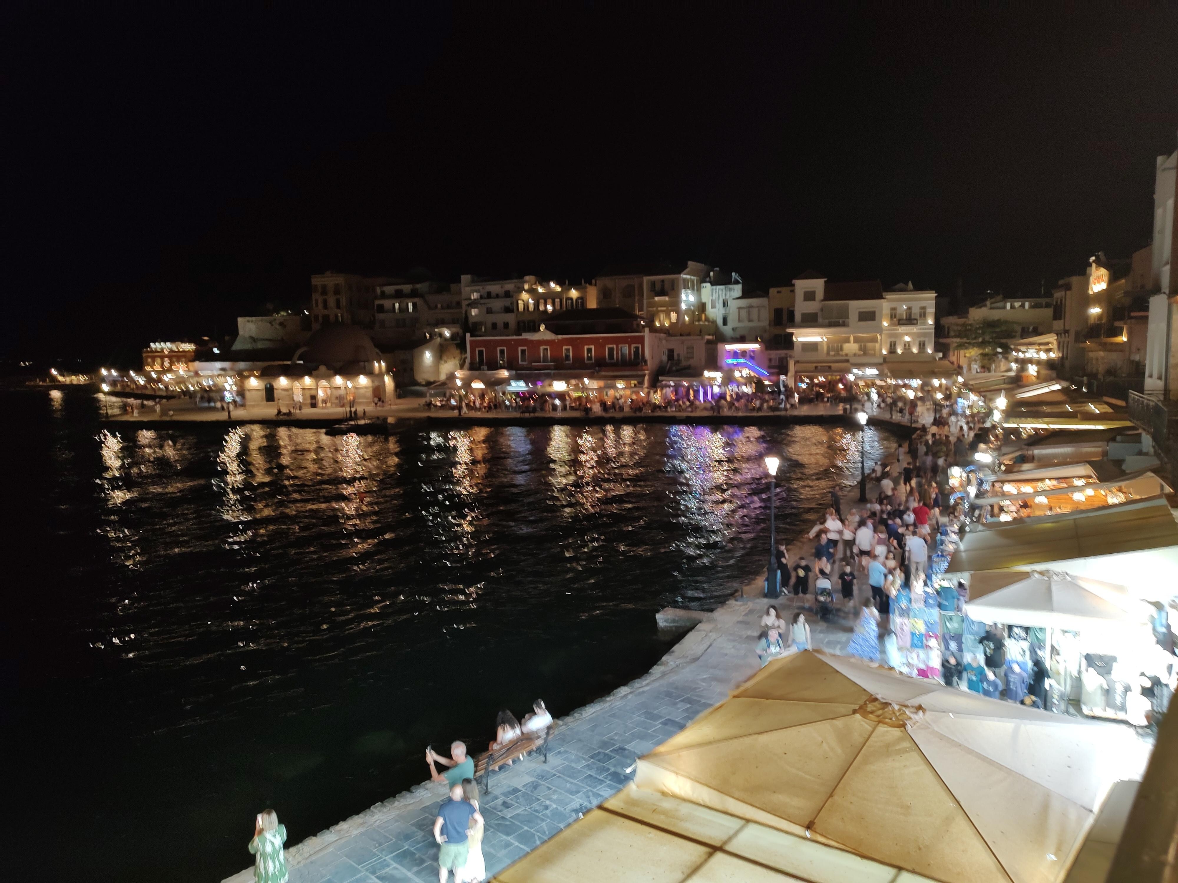 Harbor at night to the right of hotel balcony 