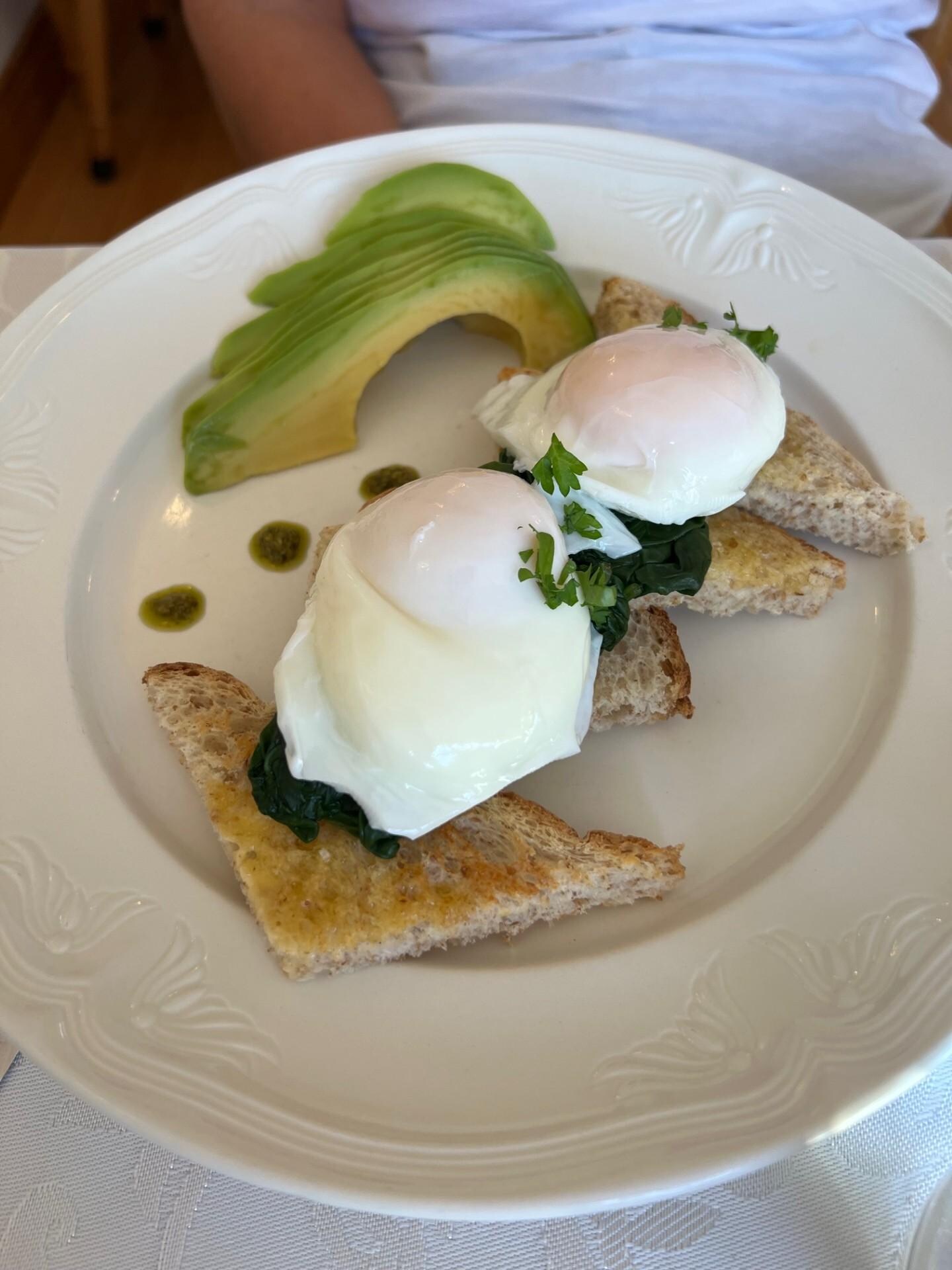 Breakfast, egg on toast with avocado.