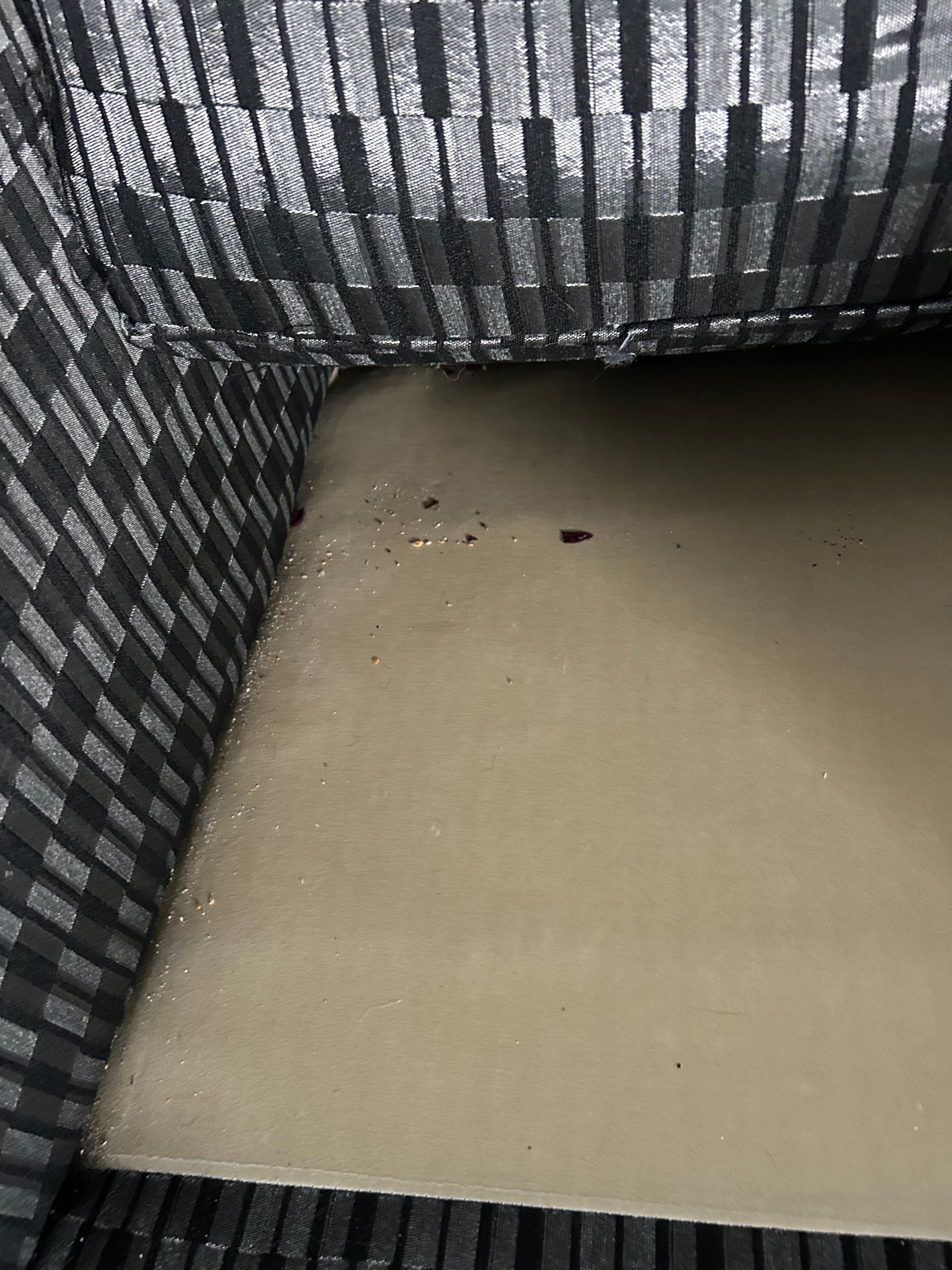 The cushion was on backwards and when I lifted it it was full of crumbs and dirt