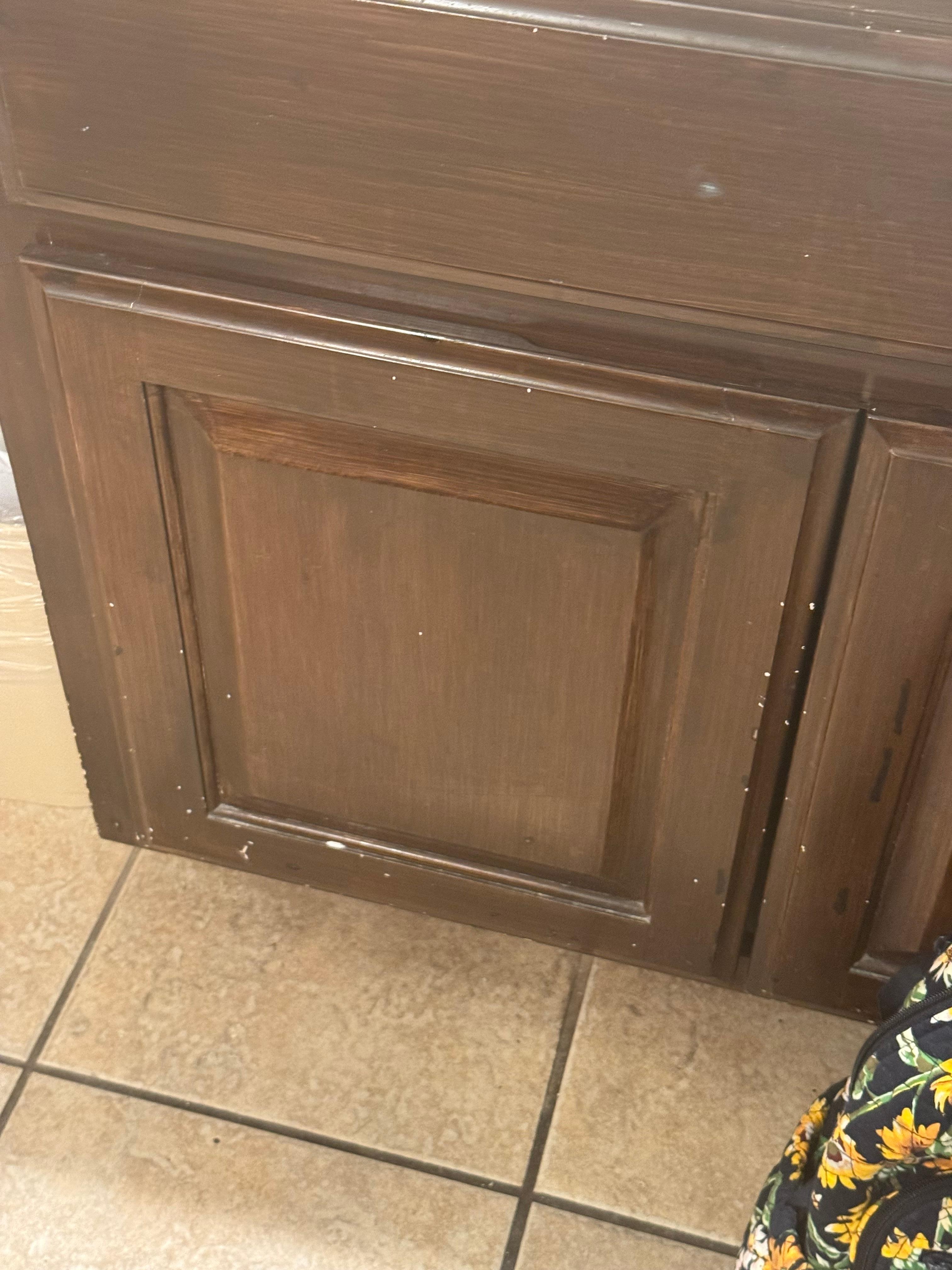 Old chipped cabinets in bathroom