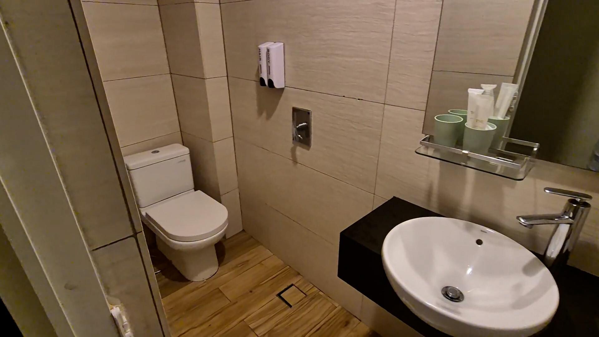 Basin, toilet and shower all together. Shower water flooded toilet.