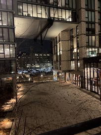 balcony view of courtyard at night .
