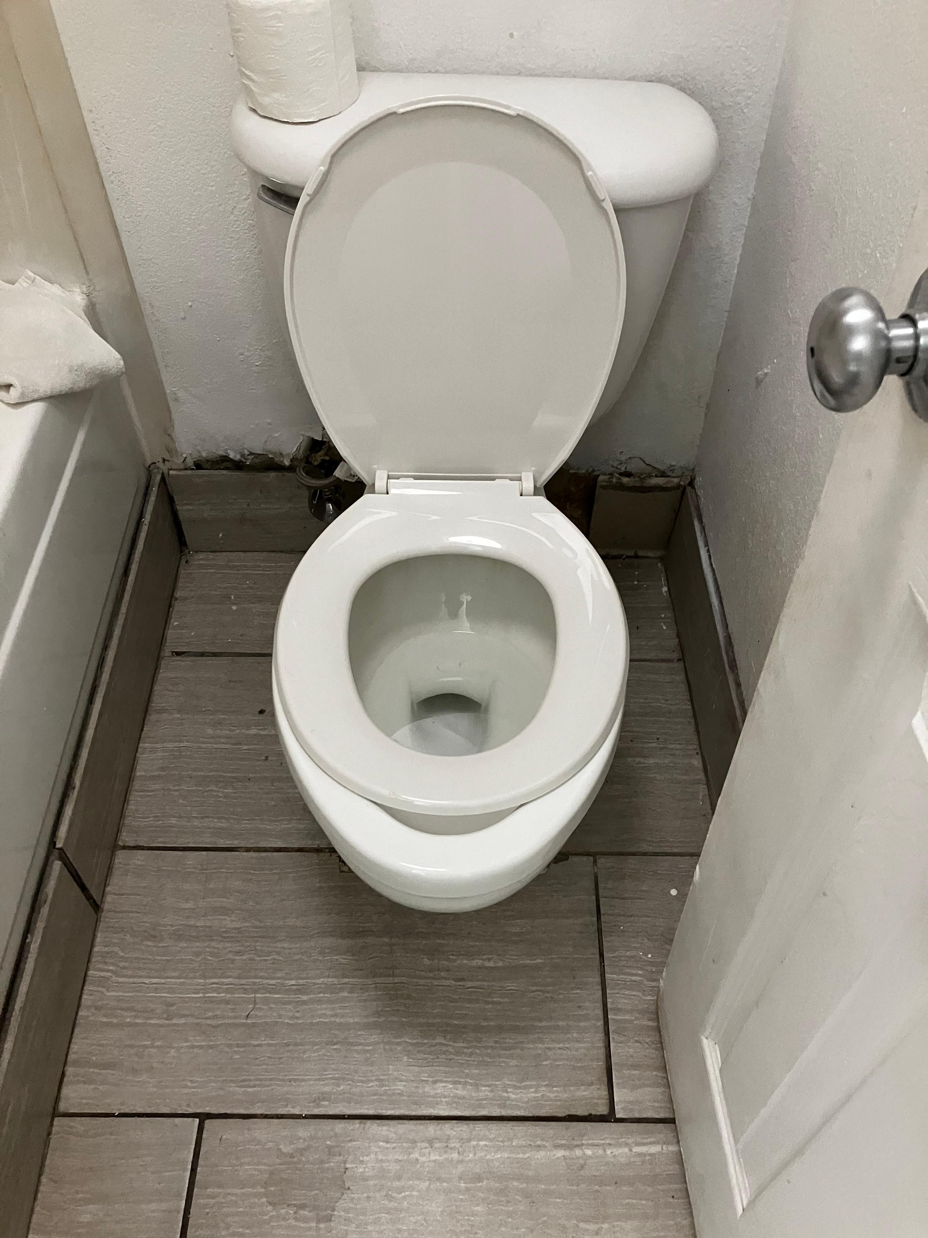 Round toilet seat on an oblong toilet- why?