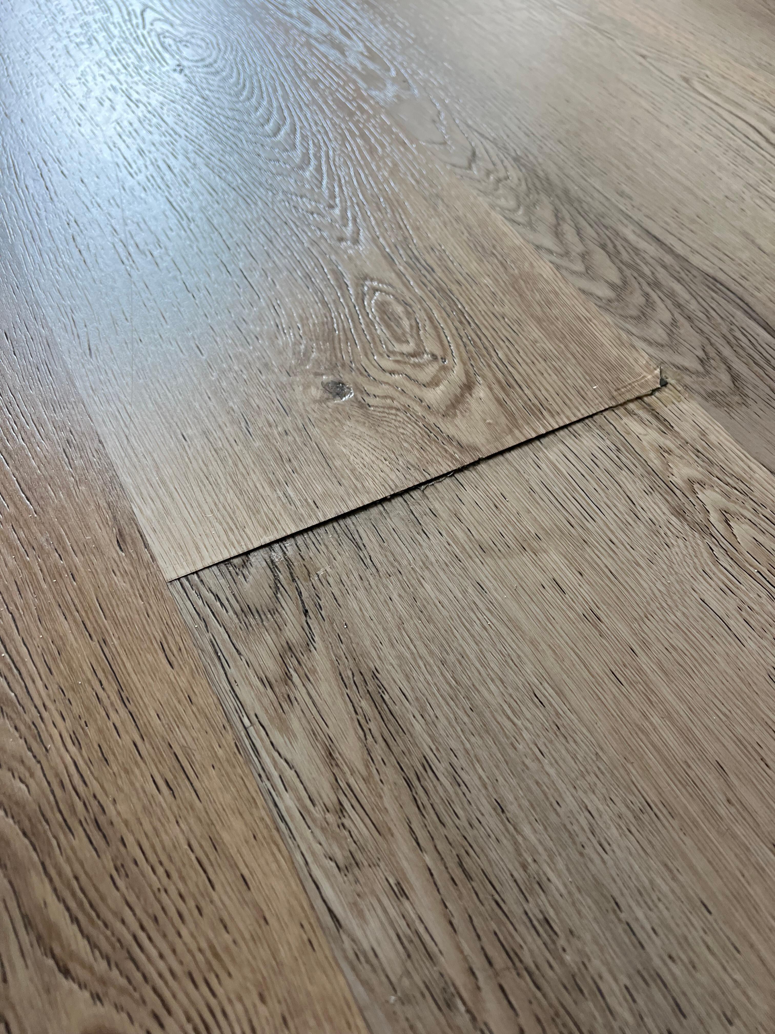 Flooring popping up in my room