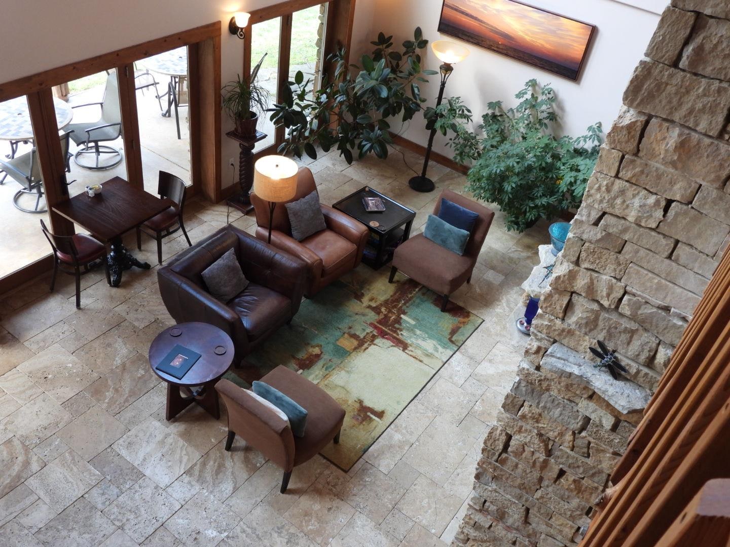 View from entrance down into fireplace sitting area.