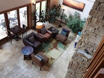 View from entrance down into fireplace sitting area.