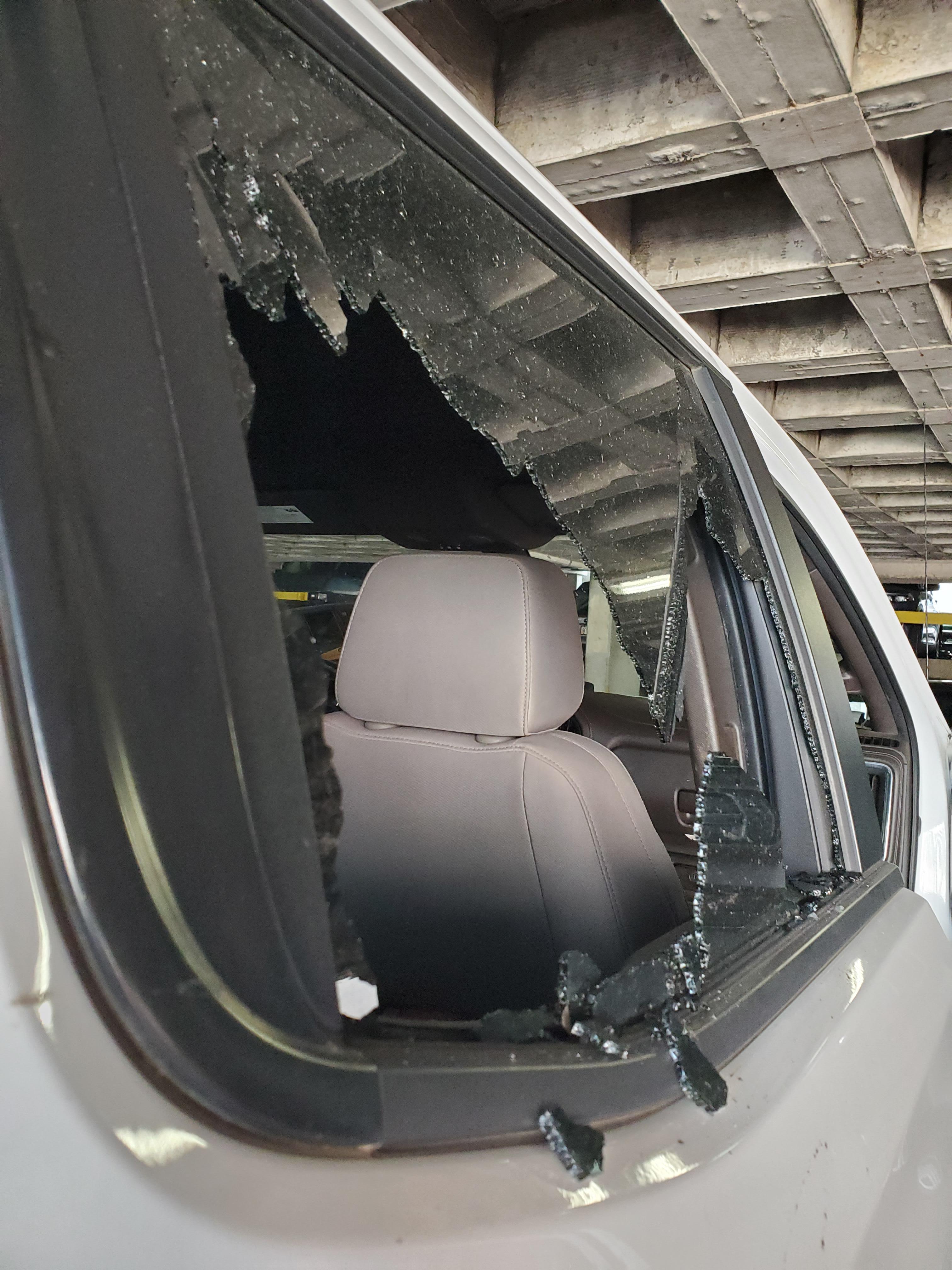 Vandalized back passenger window, exterior view