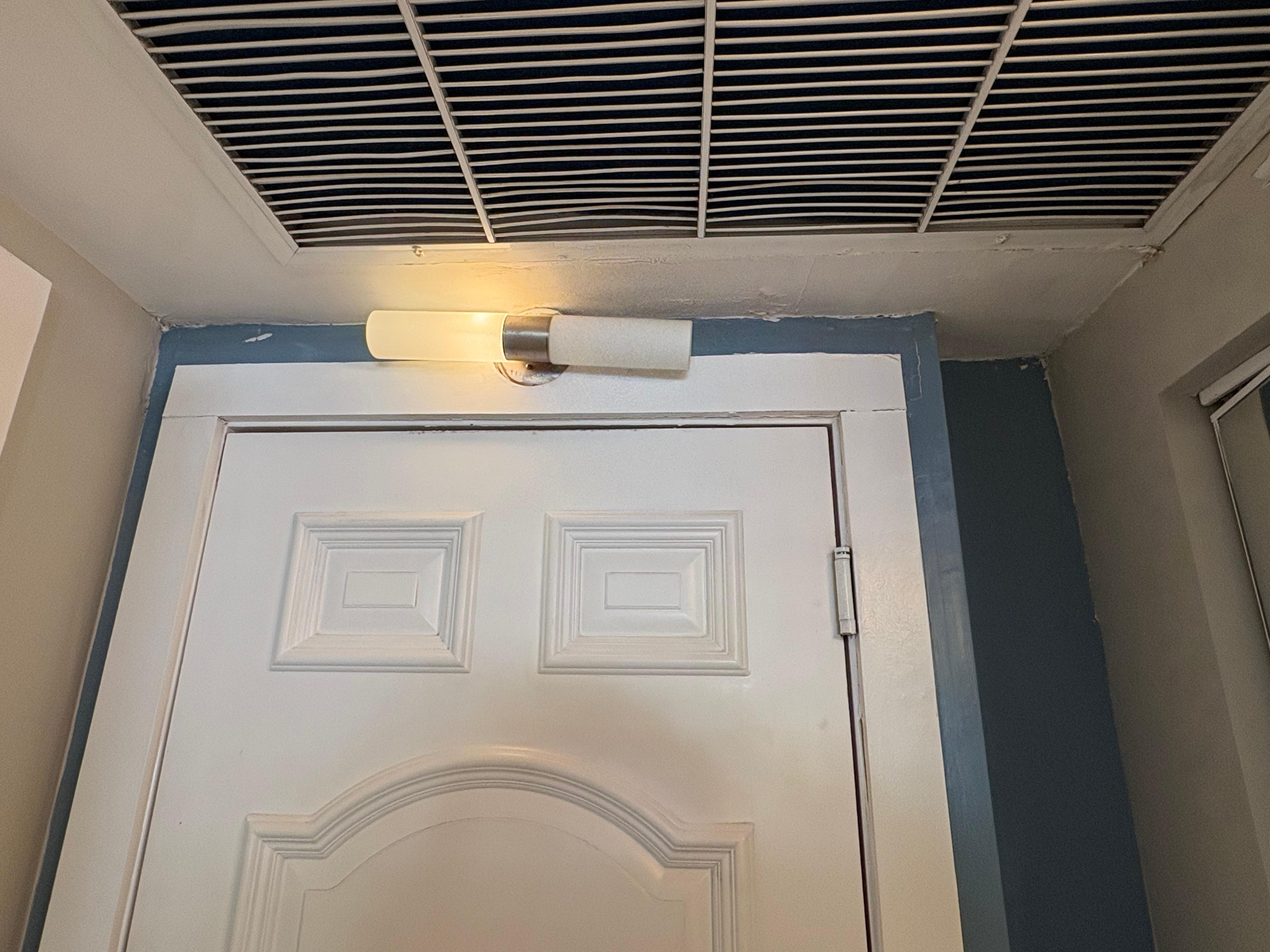 Light hanging at weird angle, not fully functioning and poor construction craftsmanship.