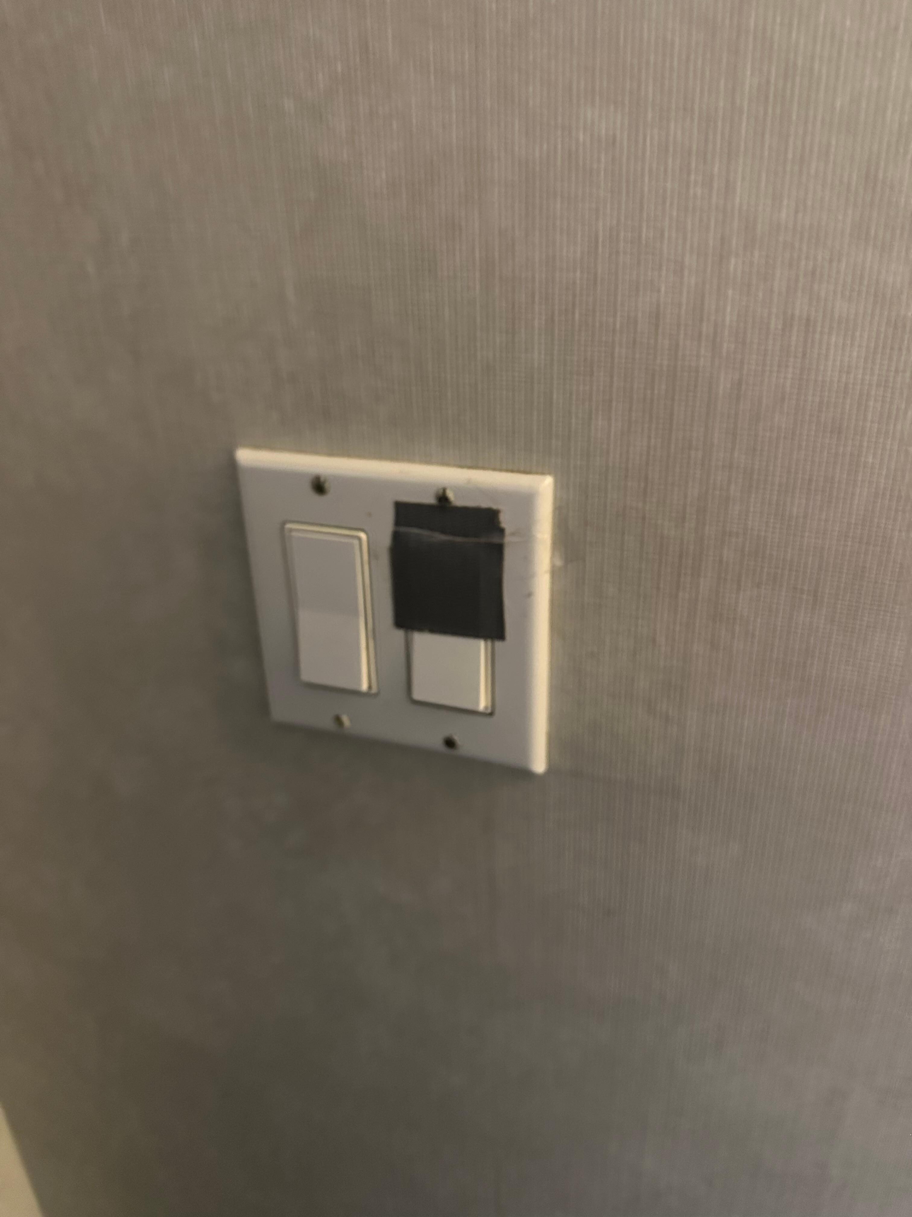 Duck taped light switch?!