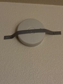 Smoke detector metal
strapped to the wall