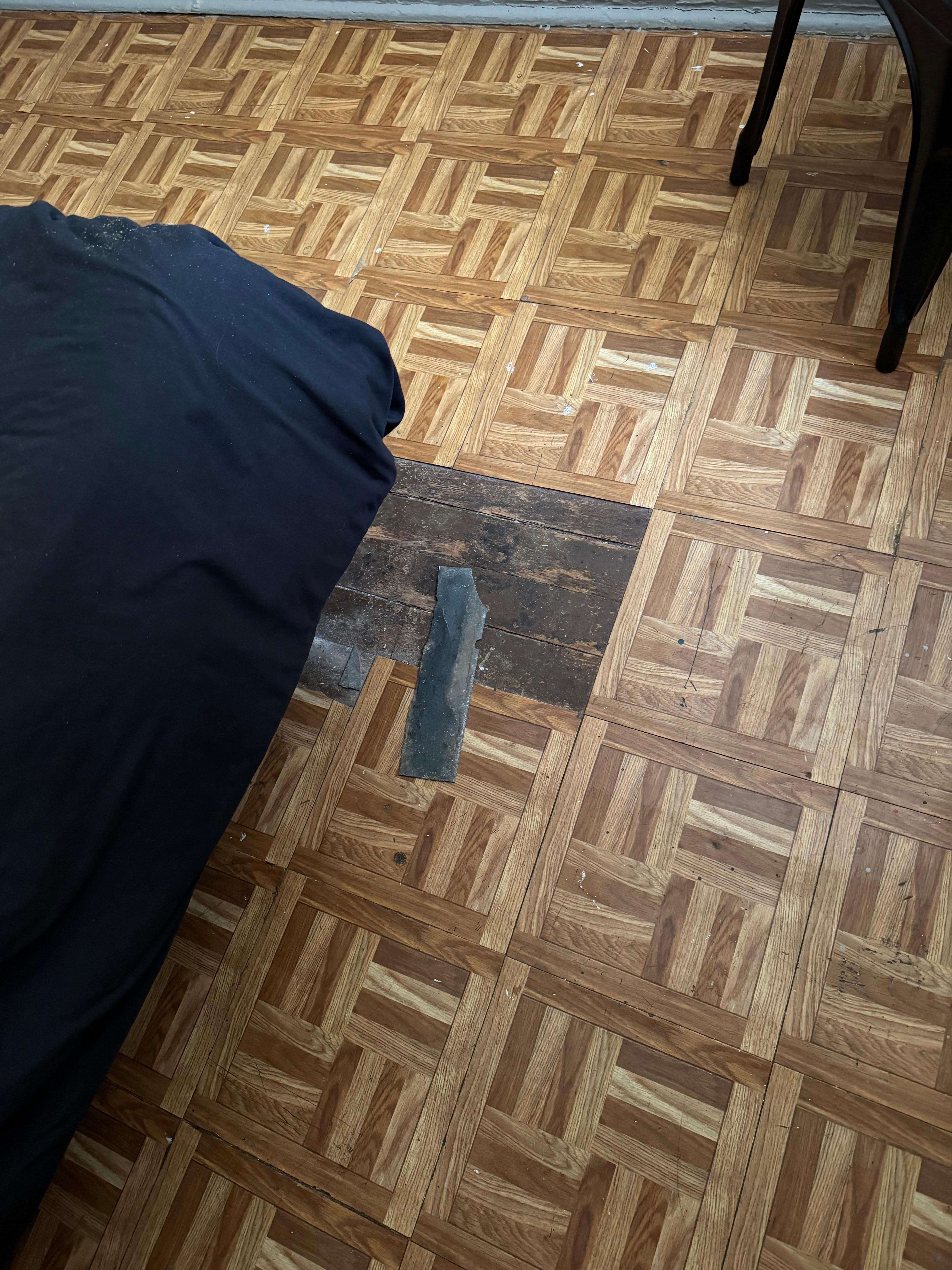 Missing and broken tiles on the floor. 