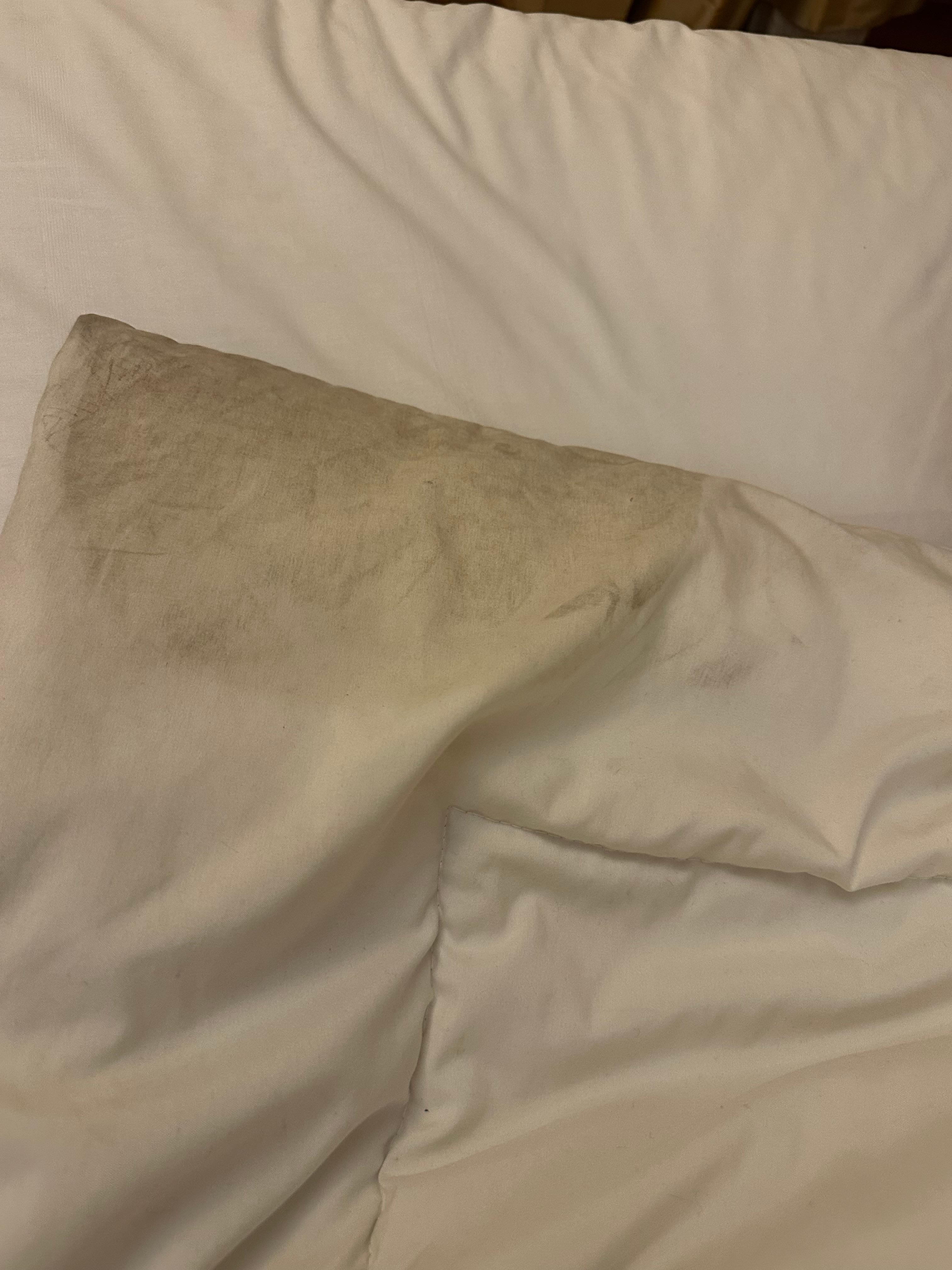 Visibly dirty bedding upon arrival. 