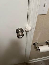 Bathroom door wouldn’t stay shut unless I used some paper to help
