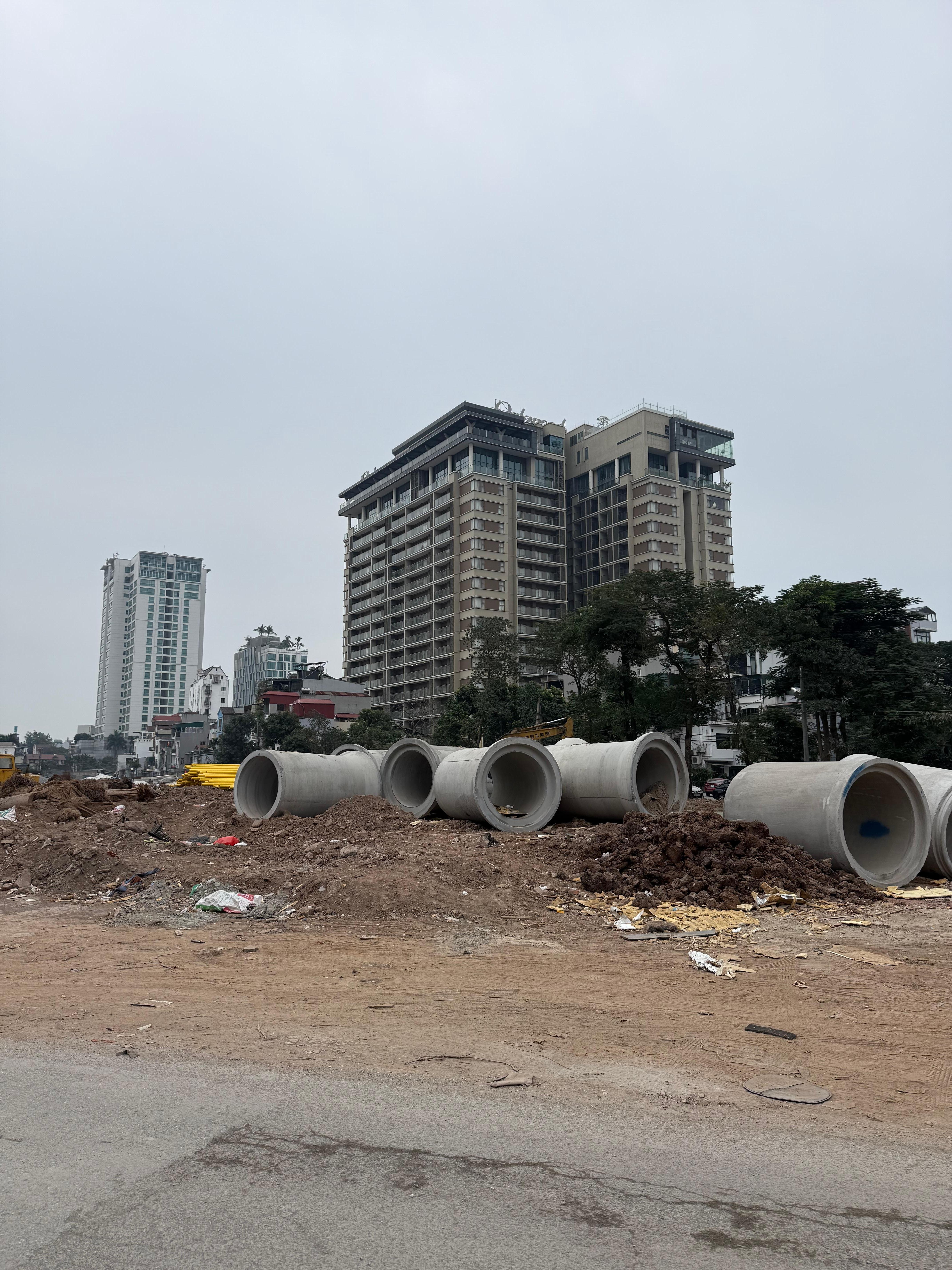 Hotel building with surroundings. 