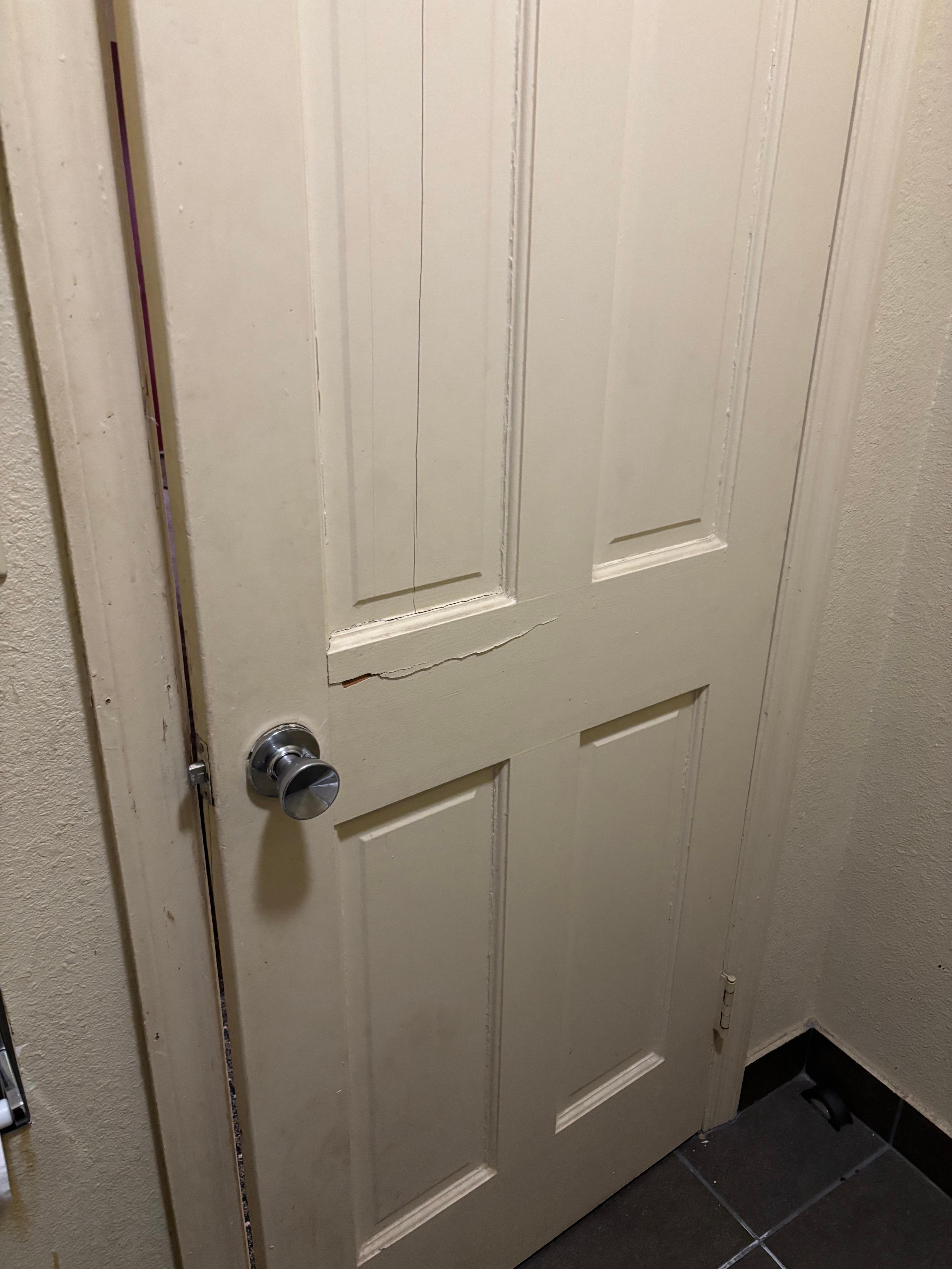 This is the bathroom door that was closed. Look like somebody tried to break in at one time before serious make