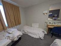 Child's bed right next to a very hot radiator. Which is absolutely unsafe and dangerous and against all safety regulations. And like a dog bed as a mattress on the floor of pet friendly room which is not as described, when booked.