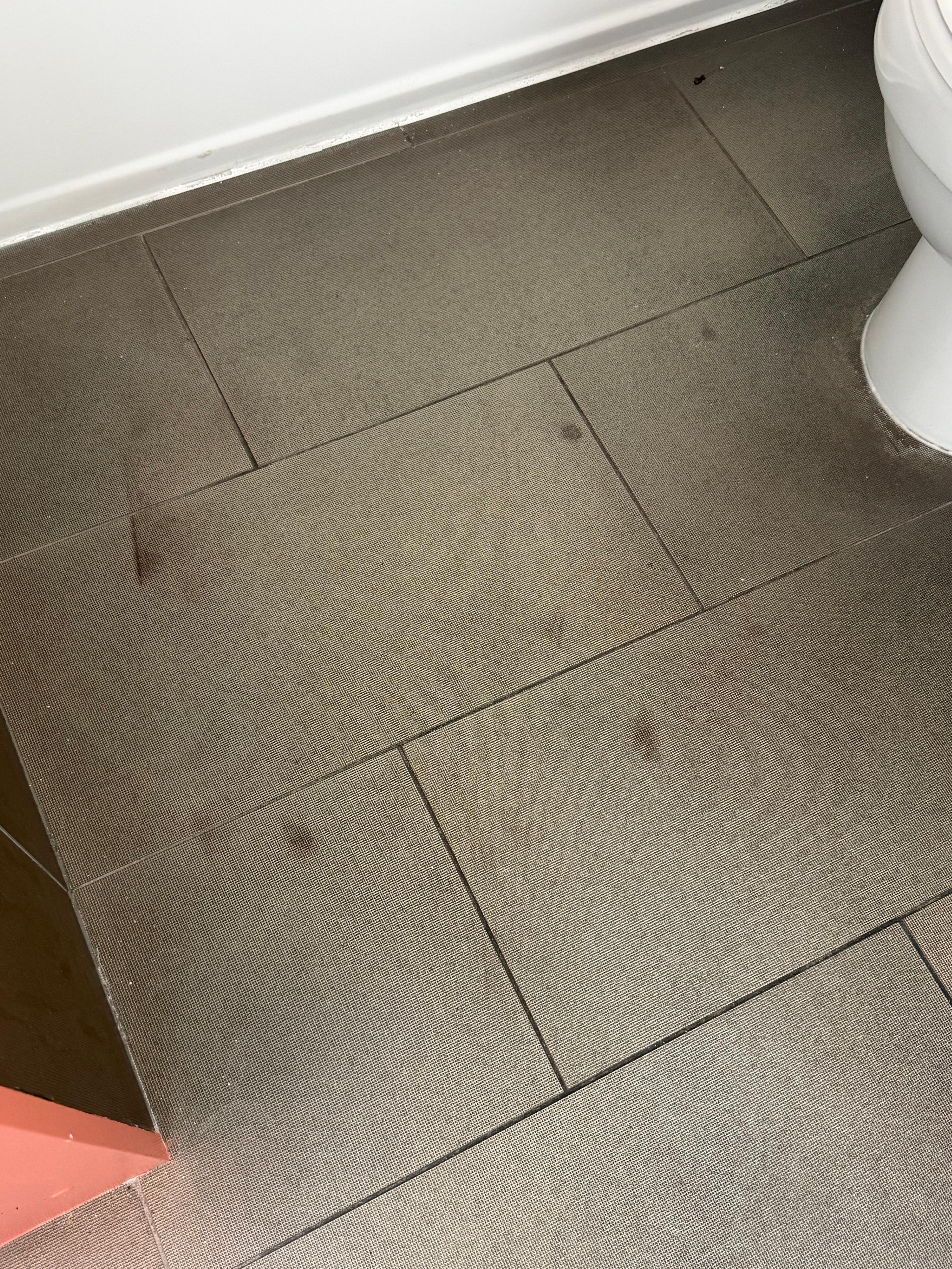 Dirty bathroom floor upon our arrival. 