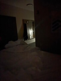 The light bouncing off the mirror onto the bed. Poor design.