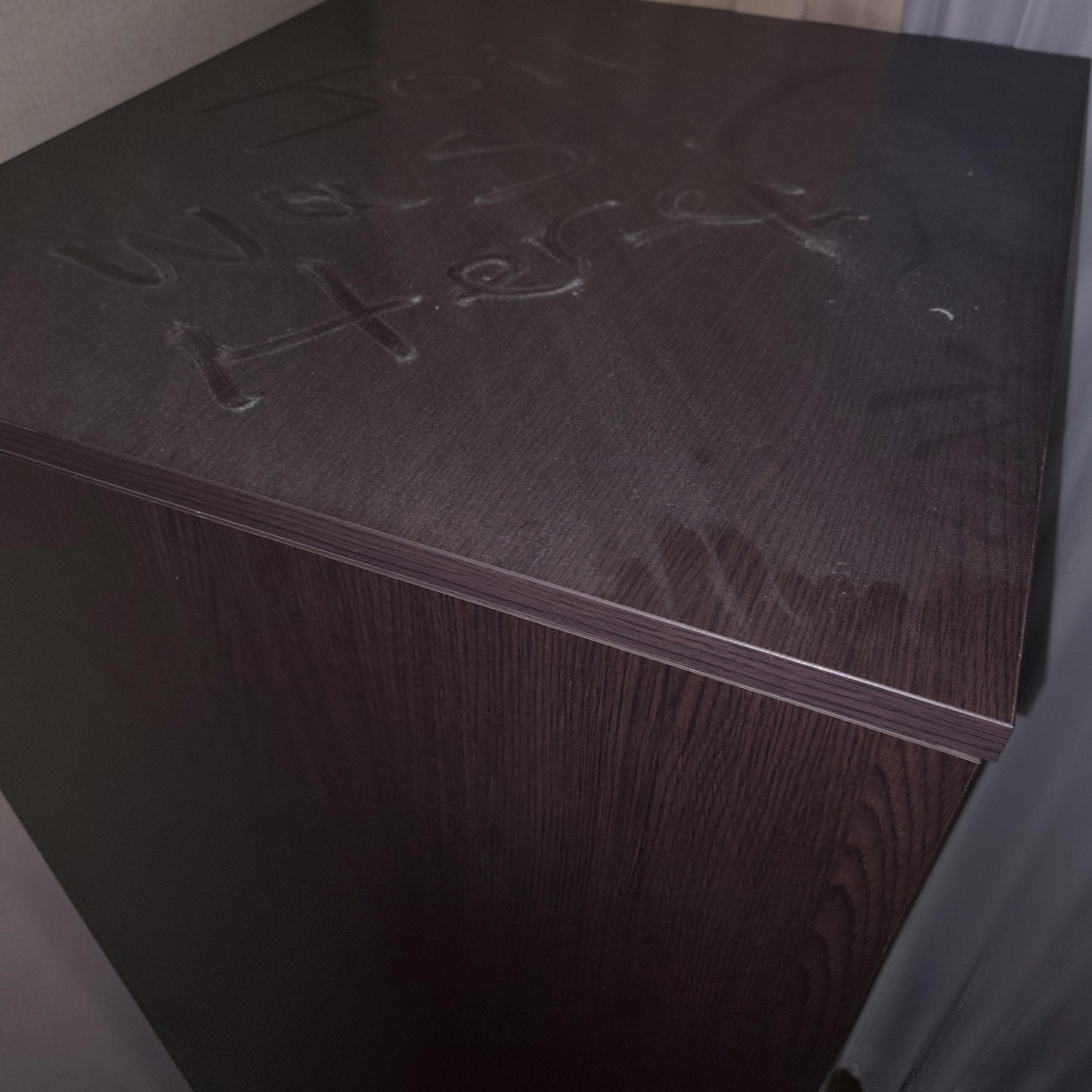I signed my own name in the dust on the dresser. 