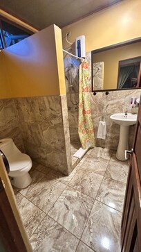 Nice bathroom with hot water and water temperature controls. Very updated above the usual Tico Shower. Though I like those too!