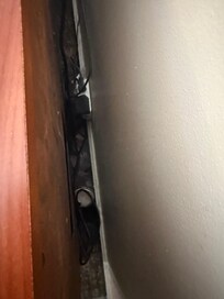 Trash behind dresser. We tried fixing the broken tv