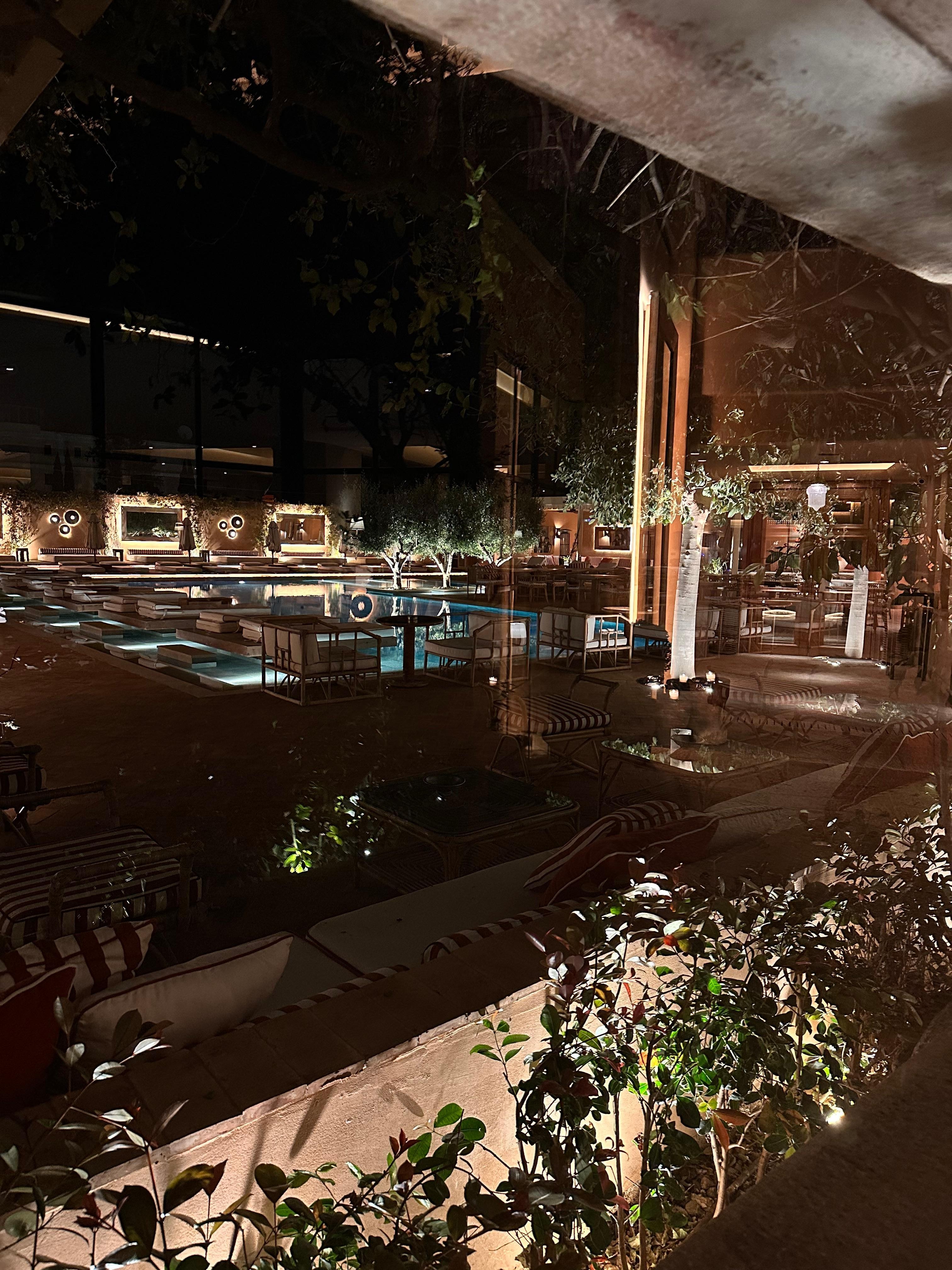 The pool and entrance at night 