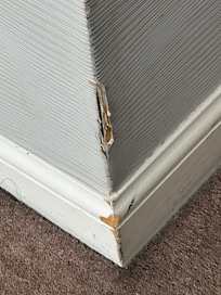 Damaged wallpaper.
